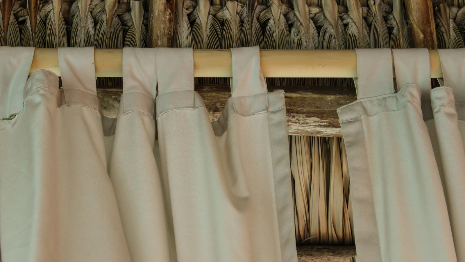 How To DIY A Set Of Drop Cloth Curtains To Bring Privacy To Your Patio